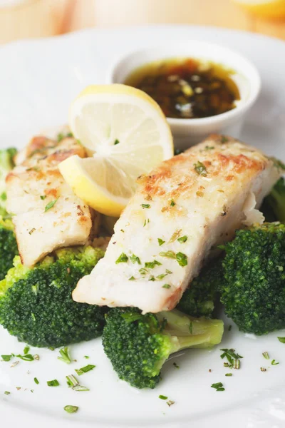 Grilled cod fish steak with broccoli Stock Photo by ©igordutina 64540319