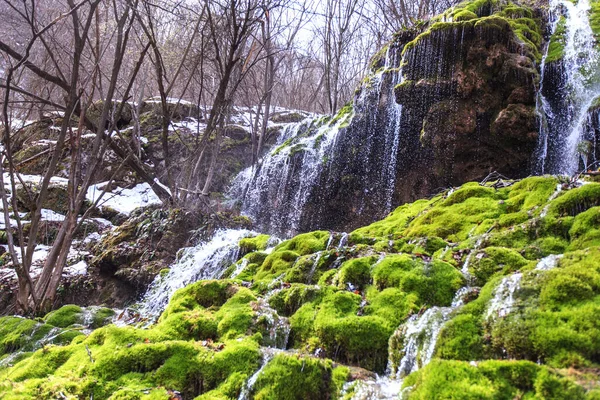 Amazing waterfall stream in forest, early spring. Nature landscape ...