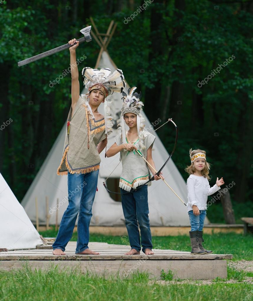 Happy children playing native american — Stock Photo © ababaka #108219186