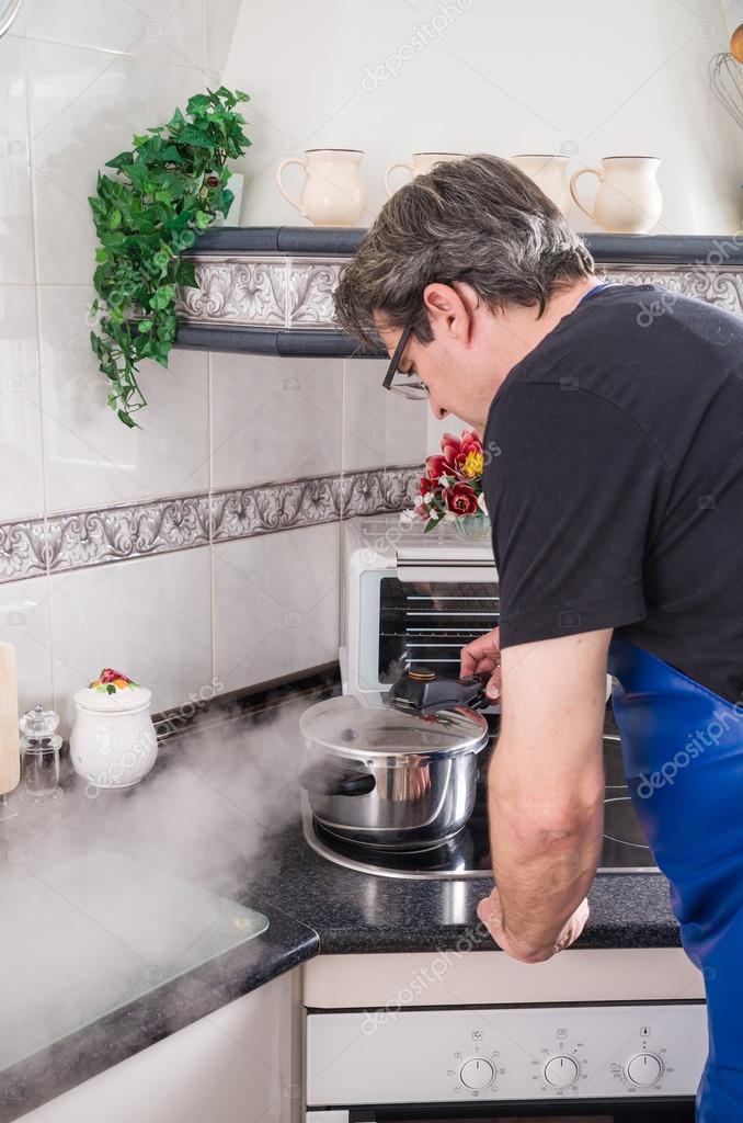 Using a pressure cooker Stock Photo by ©OlafSpeier 112359000