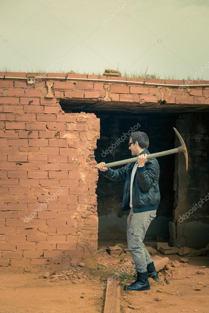 Guy pulling down a wall — Stock Photo © OlafSpeier #73252323