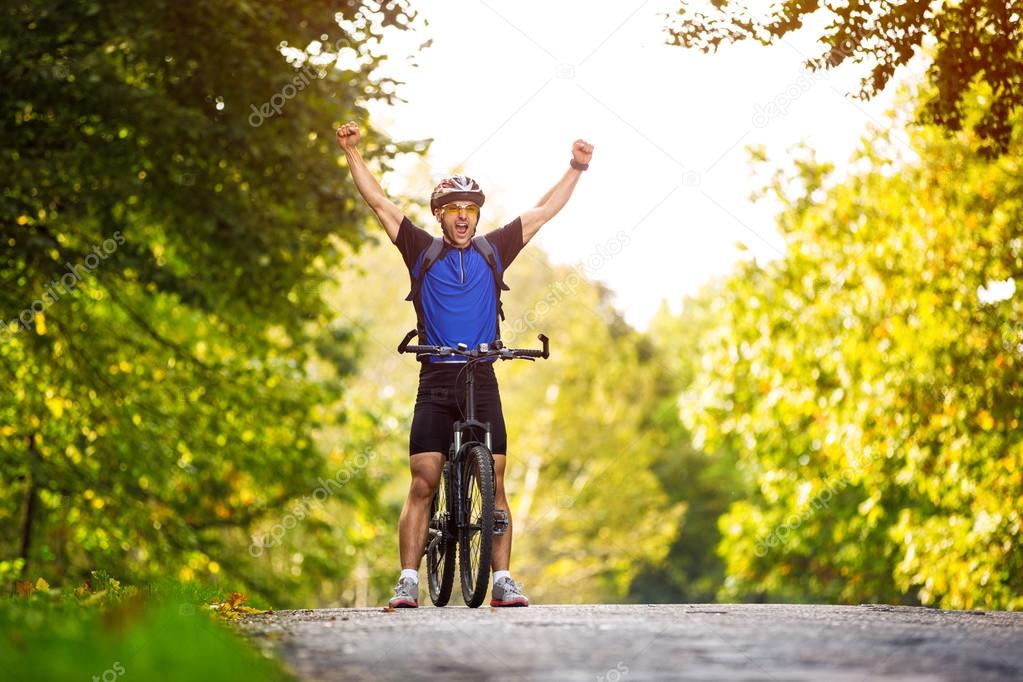 Happy cyclists in nature Stock Photo by ©luckybusiness 123025570