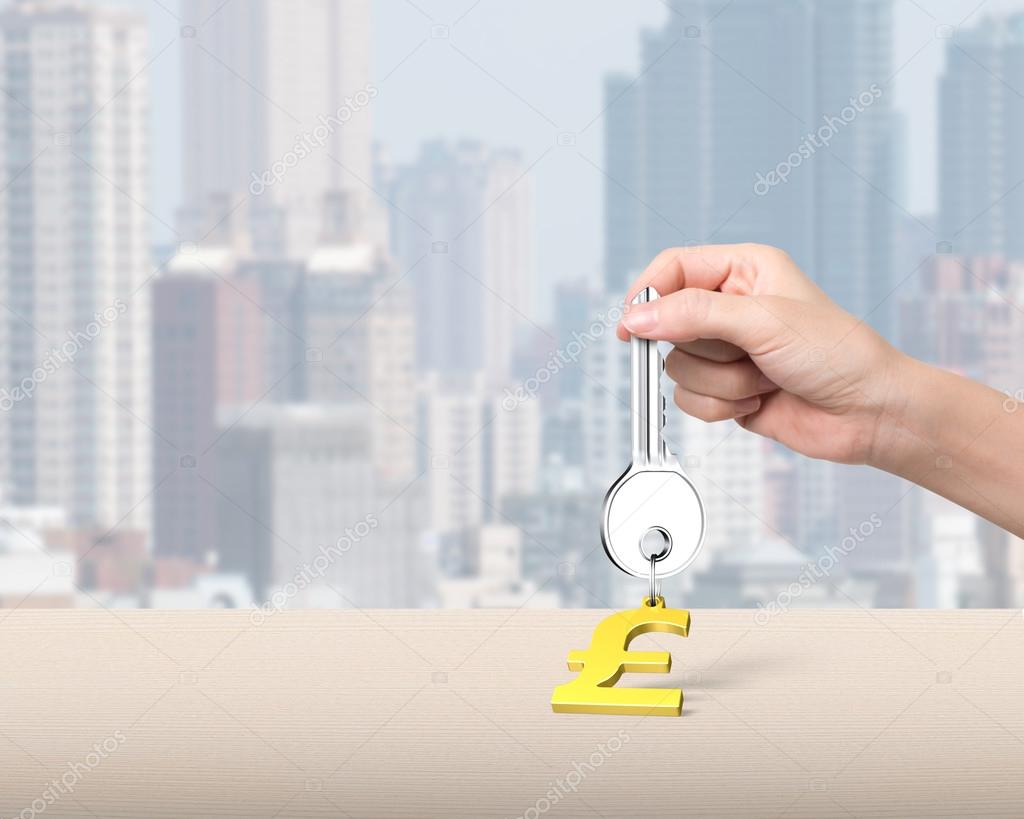 Hand holding silver key with golden dollar sign shape keyring — Stock ...