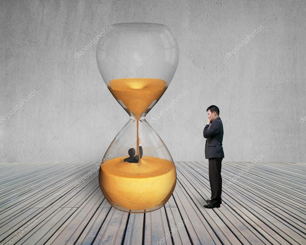 Boss oversee man flooded in hourglass — Stock Photo © bruesw #57708159