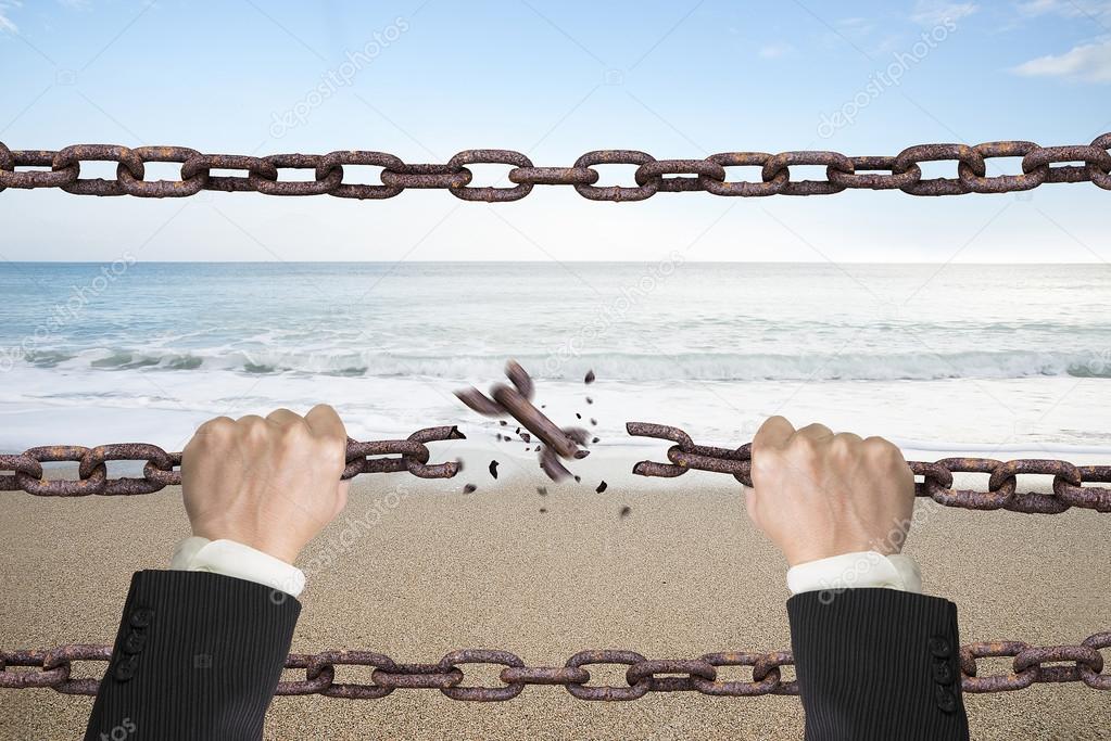 Rusty iron chains broken off by hands with sky sea — Stock Photo ...