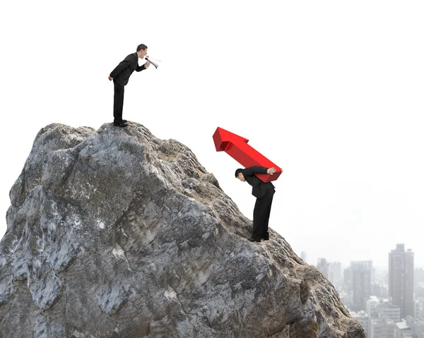 Boss using megaphone commanding employee carrying arrow sign wit Stock ...