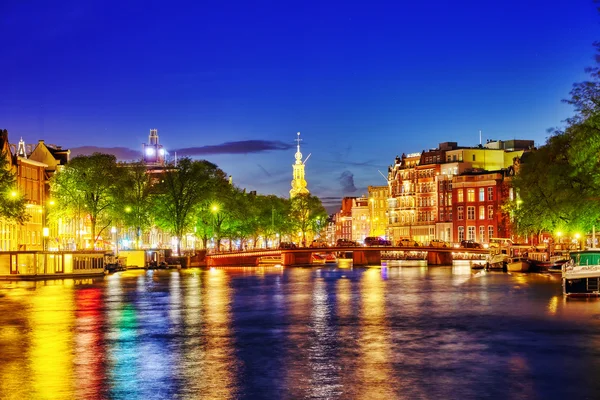 Famous Amstel river and night view of beautiful Amsterdam city. - Stock ...