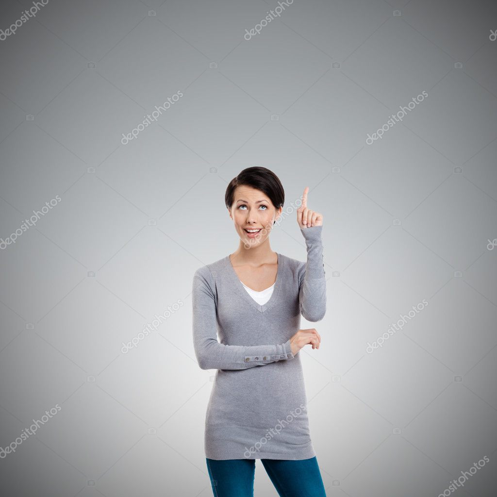 Girl pointing up hand gesture Stock Photo by ©agencyby 90702948