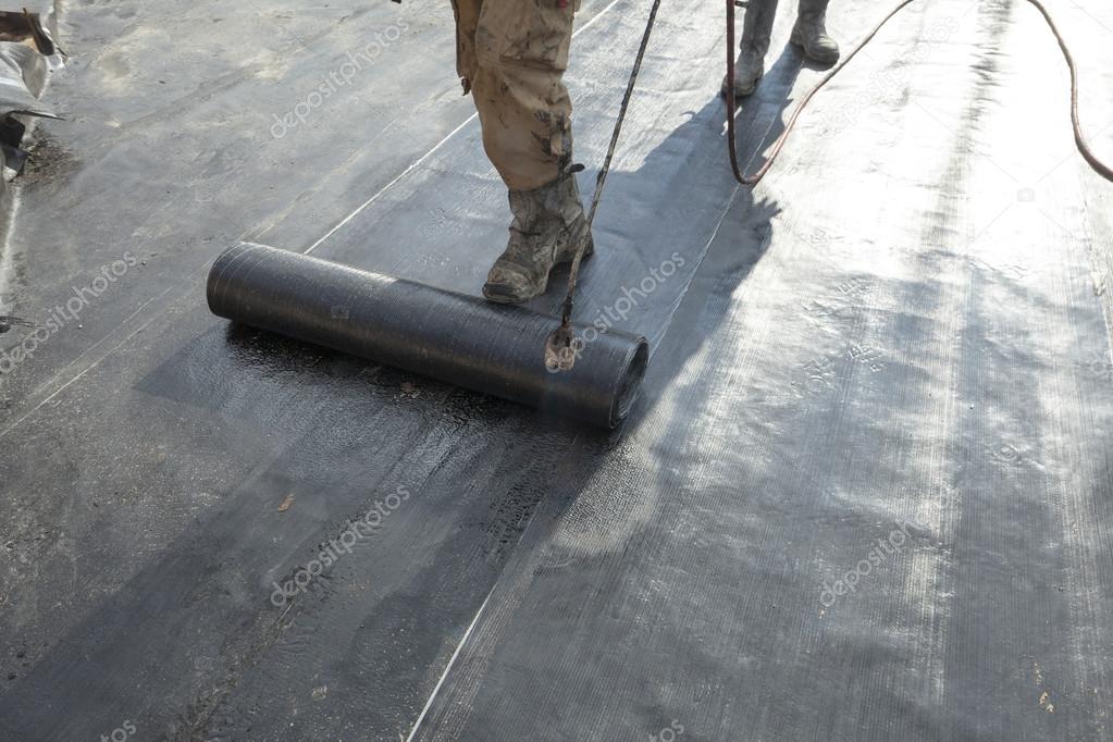 Waterproofing roll bituminous material in the trench. constructi Stock ...