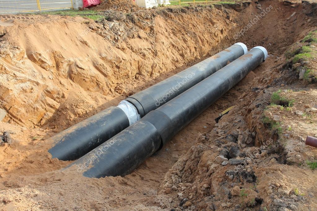 Pipes for water in trench — Stock Photo © Omstudio #65146089