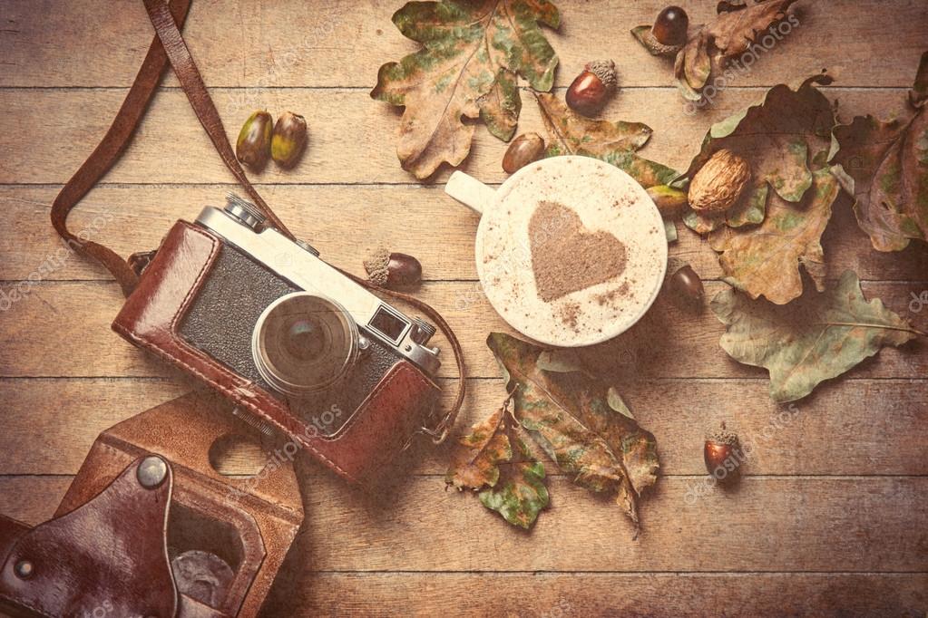 Camera and cup of coffee — Stock Photo © massonforstock #121335836