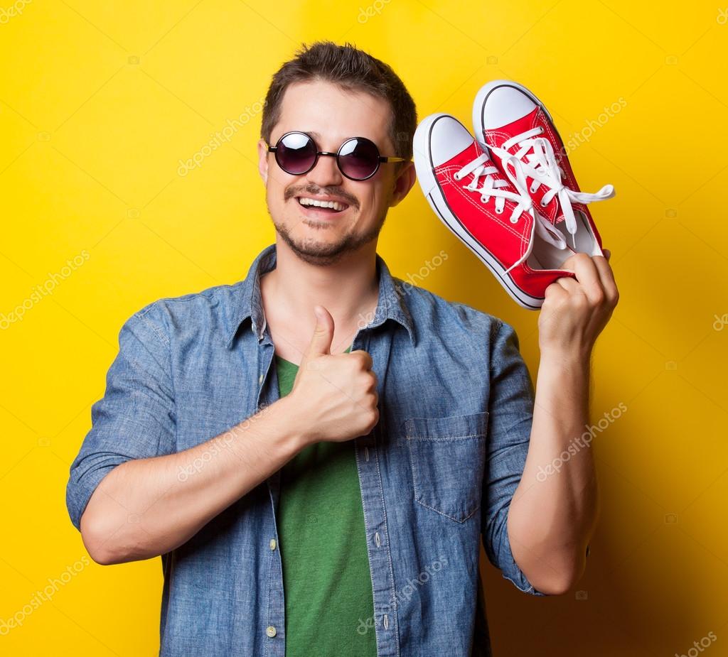 Guy in shirt with red gumshoes — Stock Photo © massonforstock #76023099
