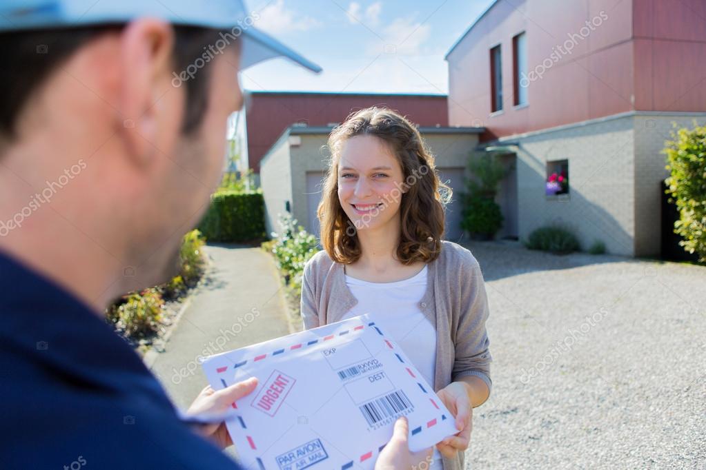 Delivery man handing over a registered letter — Stock Photo © perig76 ...