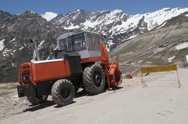 Machine for snow removal at the closed road Manali-Leh. The Himalayas ...