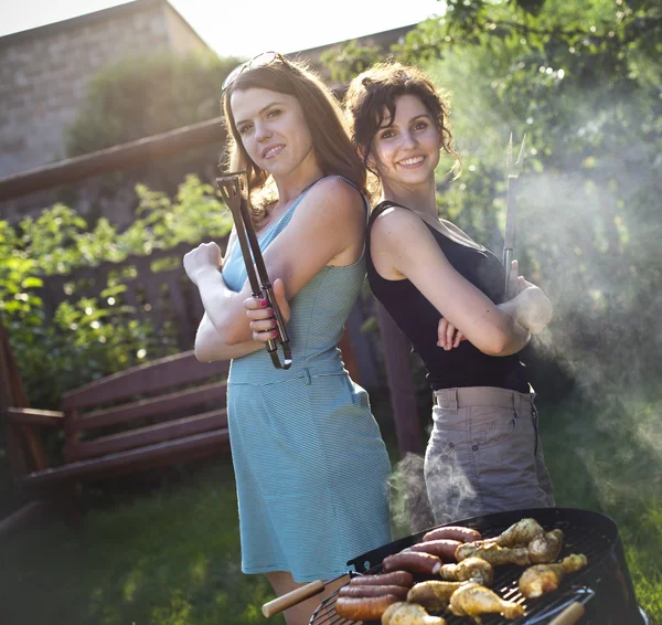 Girls making food on grill Stock Photo by ©JanPietruszka 52066555
