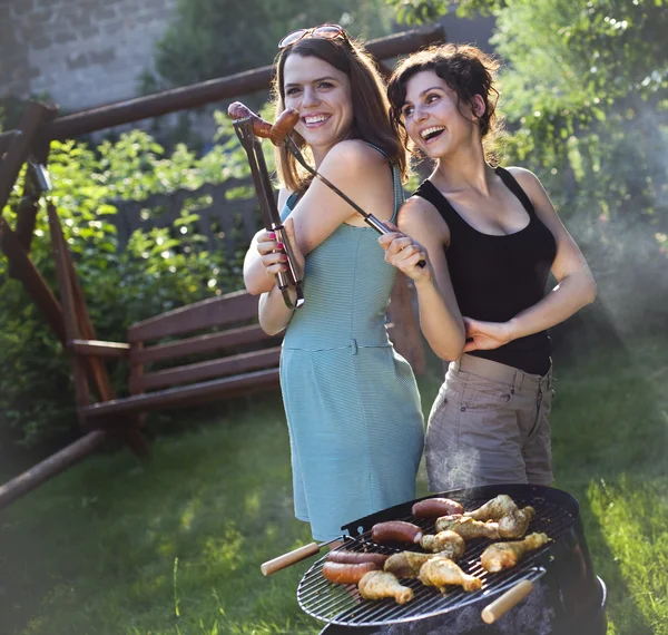 Girls making food on grill Stock Photo by ©JanPietruszka 52064969