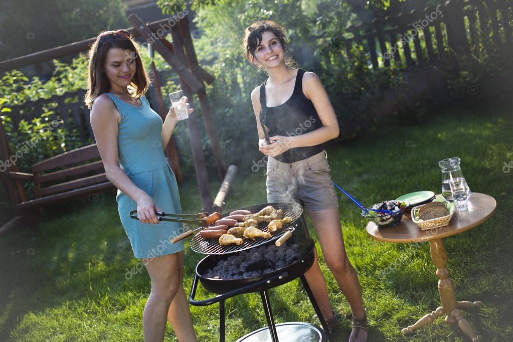 Girls making food on grill — Stock Photo © JanPietruszka #52066467