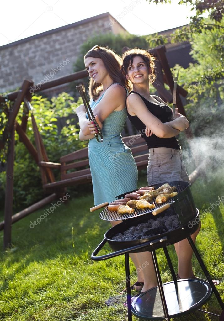 Girls making food on grill Stock Photo by ©JanPietruszka 52066555