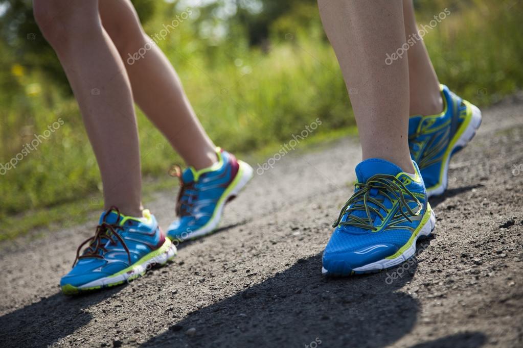 Legs of two women running Stock Photo by ©JanPietruszka 85142092