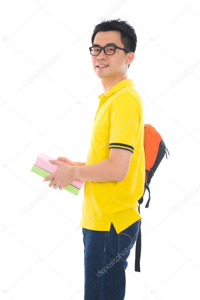 Asian male student holding books Stock Photo by ©yuliang11 52165147