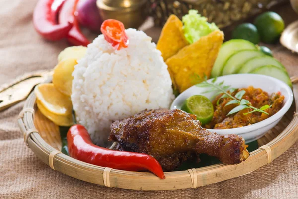 Indonesian fried chicken rice Stock Photo by ©yuliang11 48124493