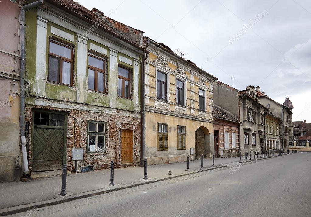 Empty street and decrepit houses Stock Photo by ©Xalanx 100444952