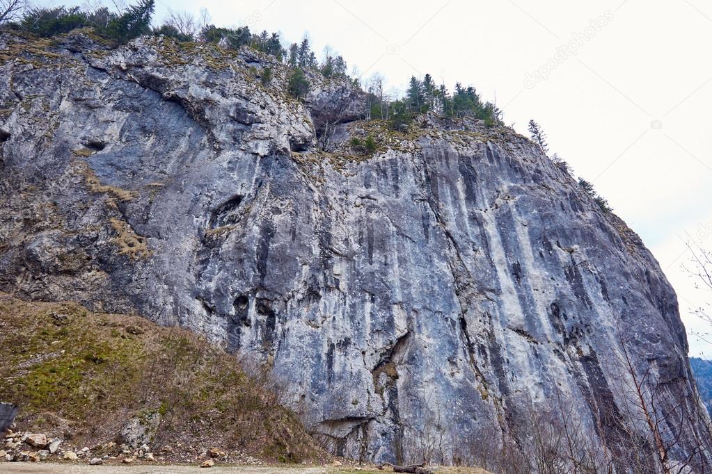 Vertical sheer cliff of a mountain Stock Photo by ©Xalanx 102541310