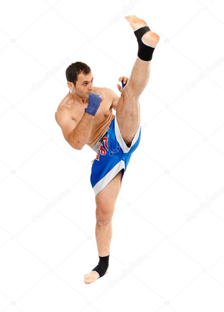 Kickbox fighter executing a kick Stock Photo by ©Xalanx 52372193