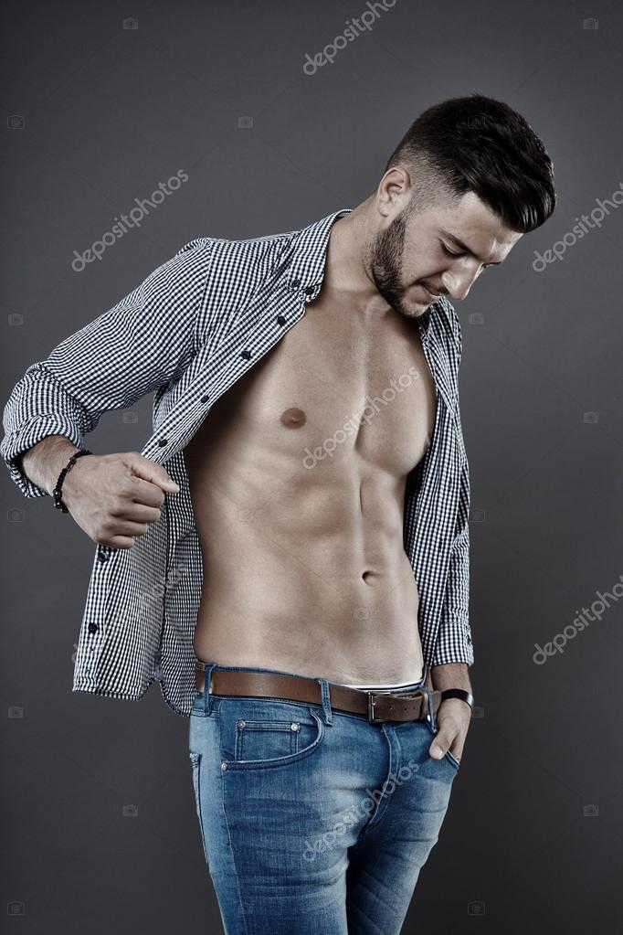 Man with unbuttoned shirt — Stock Photo © Xalanx #57213841