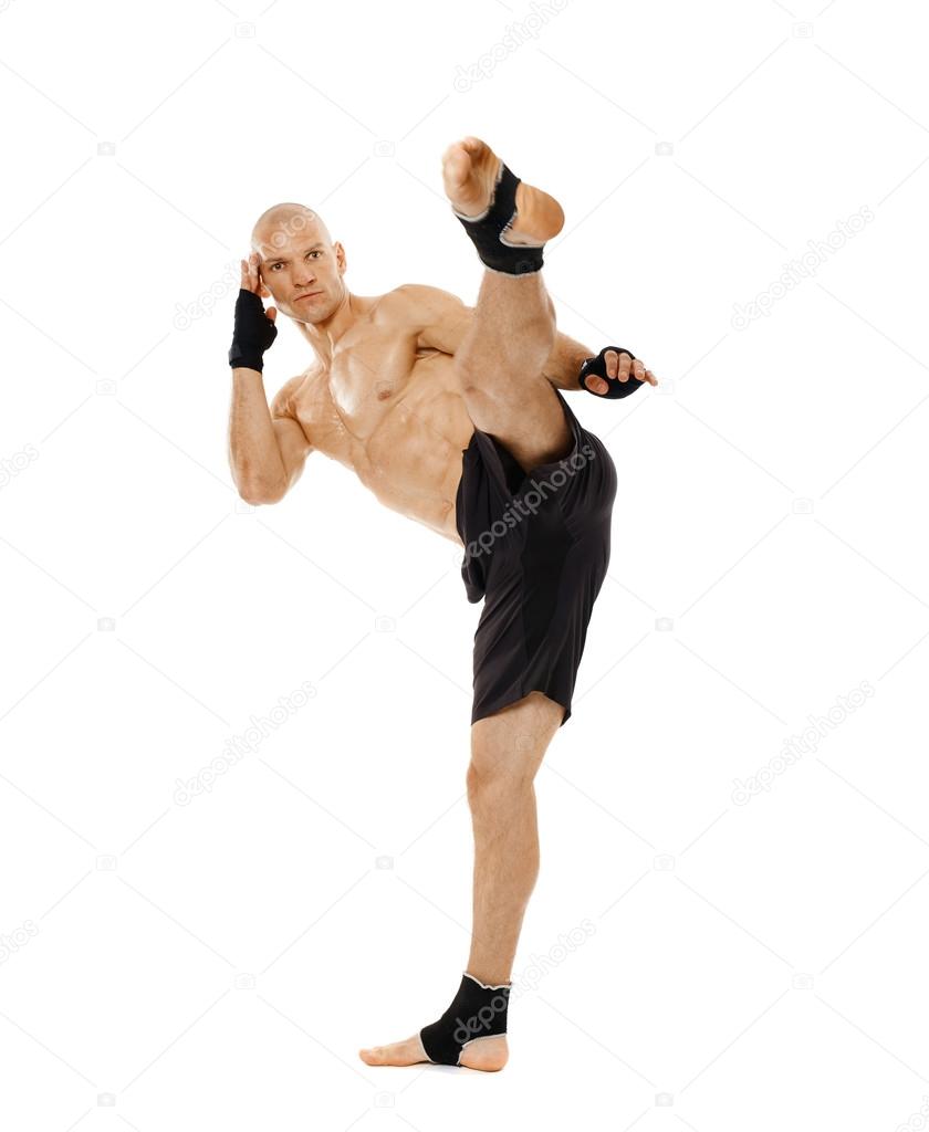 Kickboxer executing a powerful kick Stock Photo by ©Xalanx 80639262