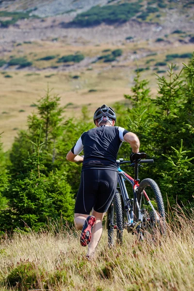 Cyclist riding on rugged trails - Stock Image - Everypixel