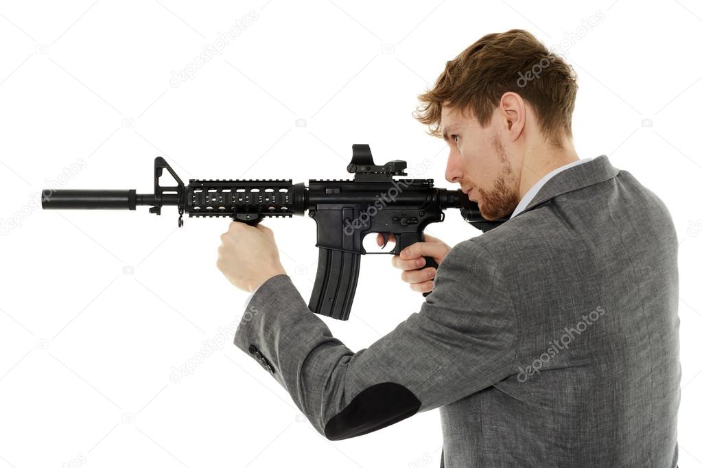 Young man using machine gun Stock Photo by ©Xalanx 93191088
