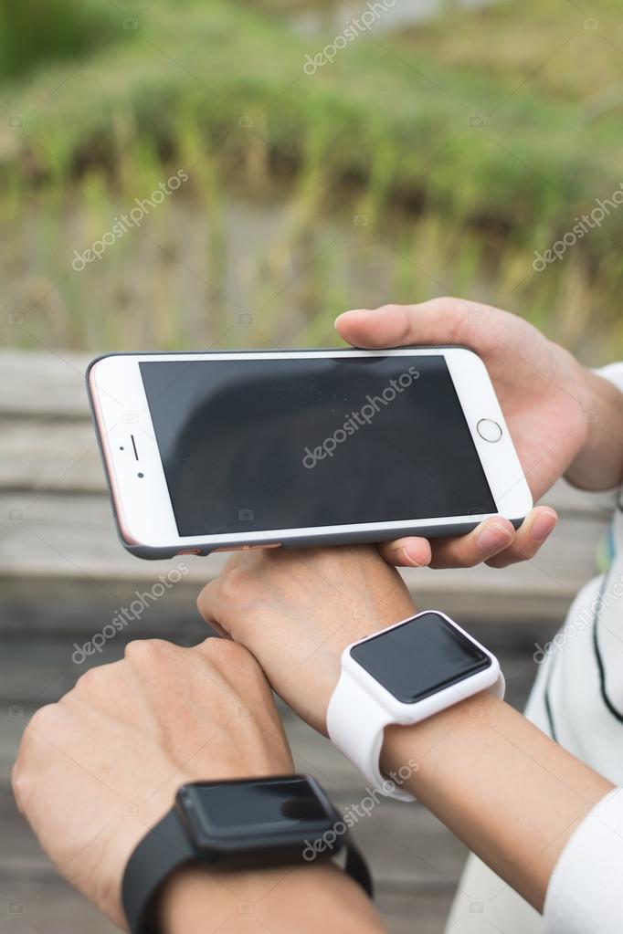 Using wearable watch Stock Photo by ©elwynn 110591486