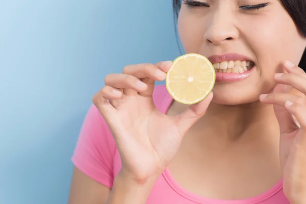Hypersensitive teeth eating lemon Stock Photo by ©elwynn 121616098