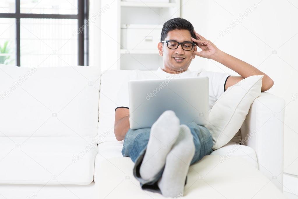 Indian guy using internet Stock Photo by ©szefei 74274611