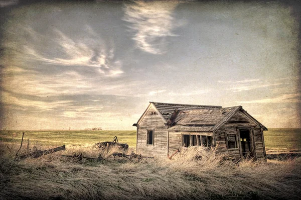 Abandoned homestead on prairie — Stock Photo © PixelsAway #3032954