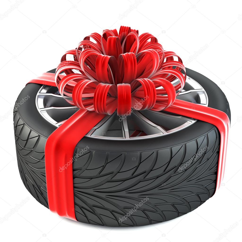 Tire wrapped in red gift ribbon Stock Photo by ©dimdimich 100556234