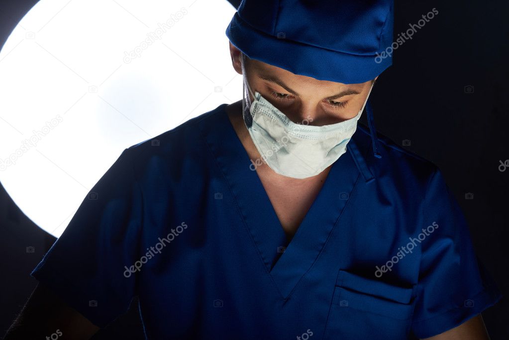 Male doctor doing operation — Stock Photo © dimarik #115258504