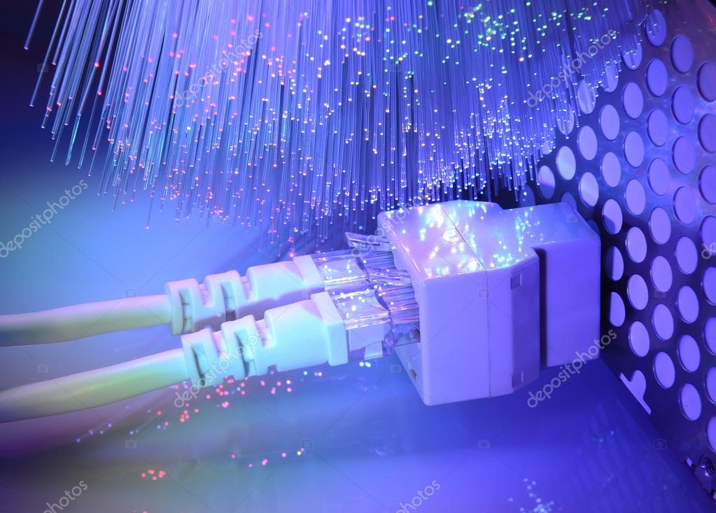 Network cables and hub closeup with fiber optical background — Stock ...
