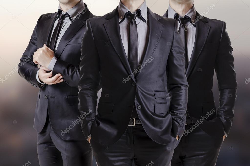 Close up image of three business men in black suit — Stock Photo ...