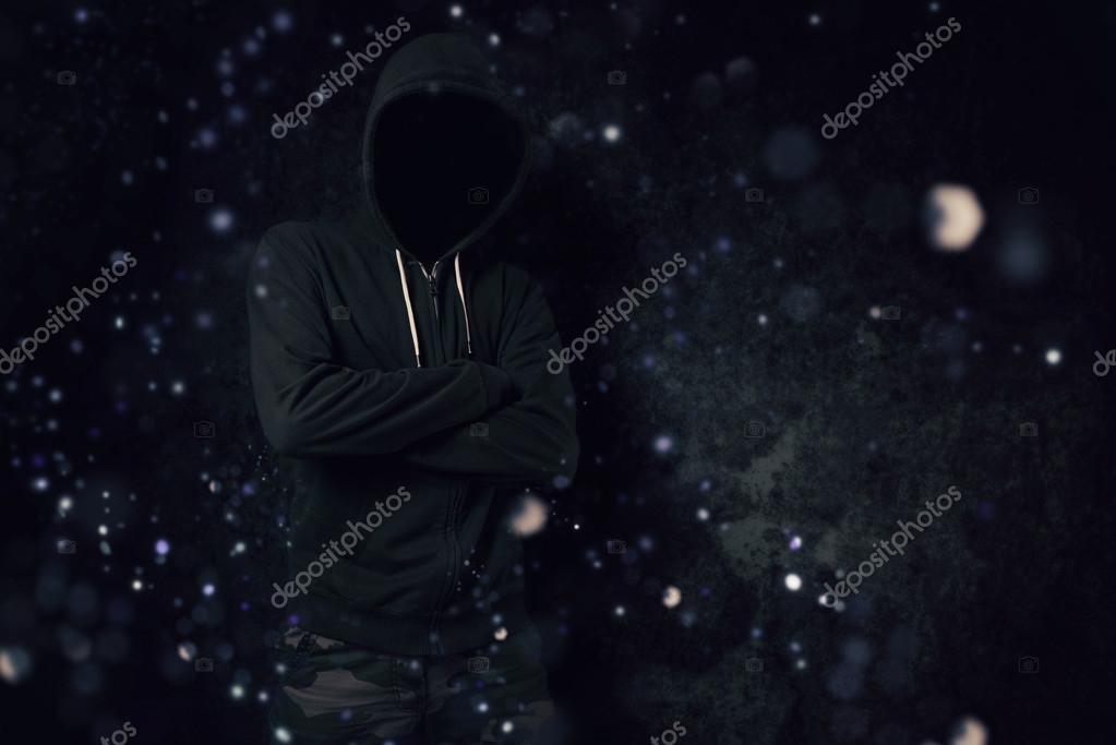 Dangerous unrecognizable faceless criminal standing in front of Stock ...