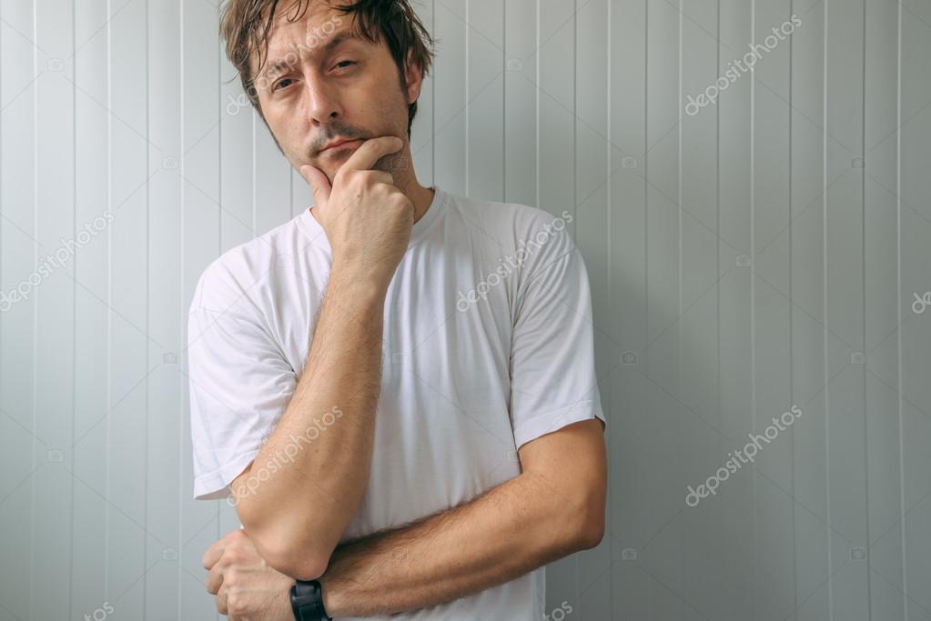 Man with disapproving look in eyes and raised eyebrow Stock Photo by ...