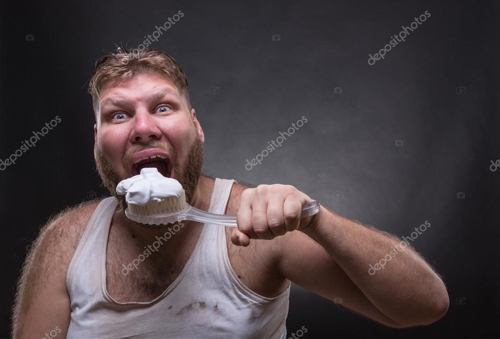 Adult man cleaning teeth — Stock Photo © Nomadsoul1 #67616085