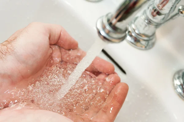 Washing hands with soap and water Stock Photo by ©kmiragaya 34491593