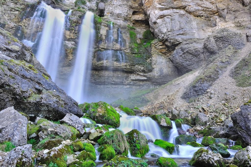Cascades over rocky walls — Stock Photo © sanddebeautheil #59586863