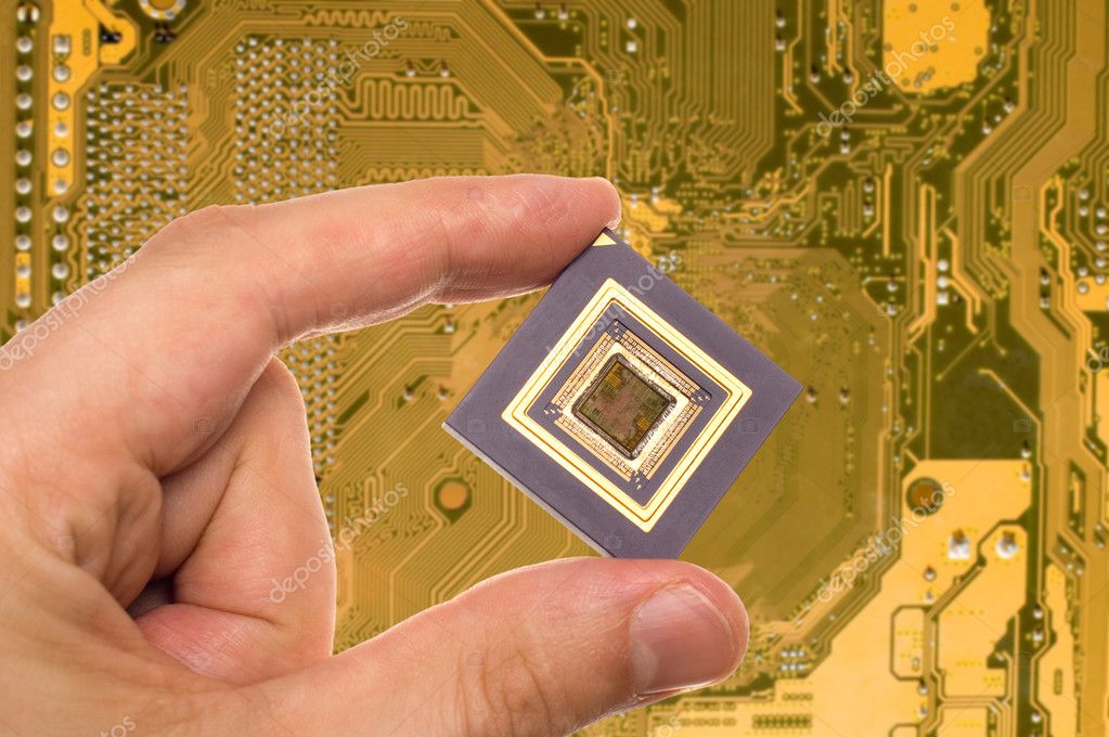 Microprocessor in hand over PCB — Stock Photo © pgkirich #104745090