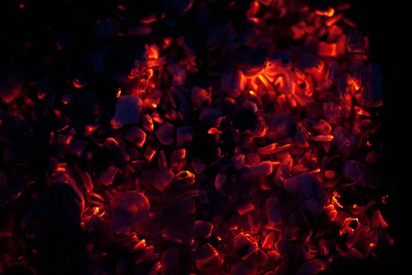 Actively smoldering embers of fire. Background of burning hot coals ...