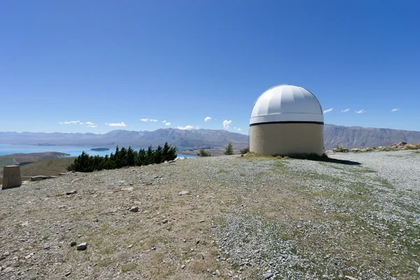 Round building on ground near lake Stock Photo by ©zhudifeng 102184654