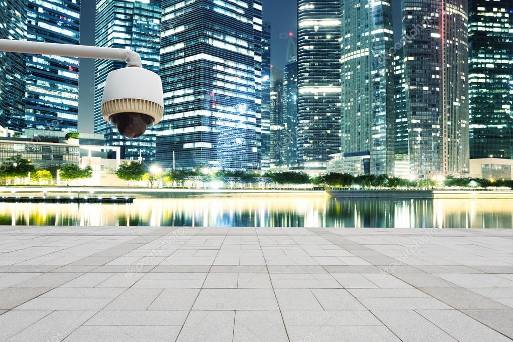 CCTV with prosperous cityscape background Stock Photo by ©zhudifeng ...