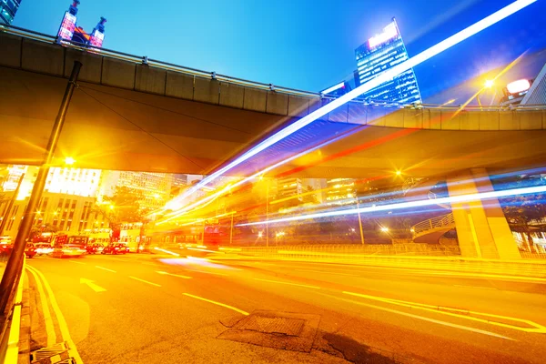 Traffic light trails in modern business city — Stock Photo © zhudifeng ...